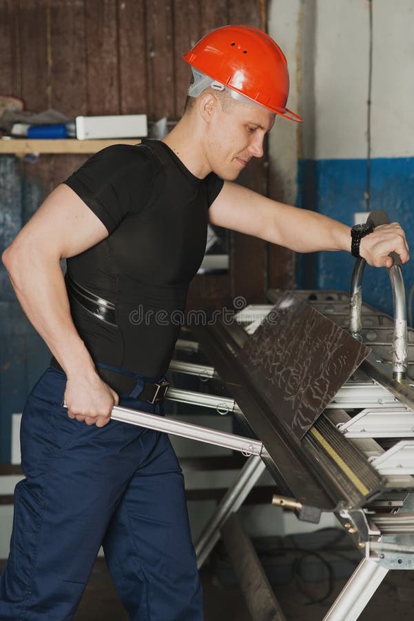 Worker Working on the Machine for Cutting Metal Sheets Stock Image ...