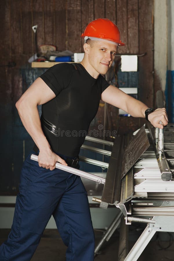 Worker Working on the Machine for Cutting Metal Sheets Stock Photo ...