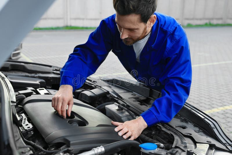 Worker Working with Modern Car Engine Outdoors Stock Image - Image of ...