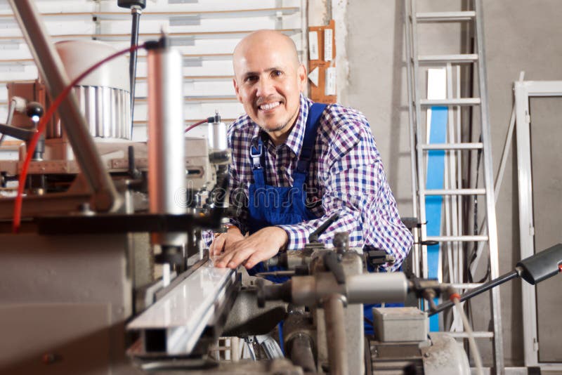 Labour Mature Working On Lathe Machine At Factory Stock Photo - Image ...