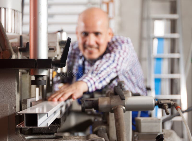 Worker Working with PVC on Machine at Industry Plant Stock Photo ...