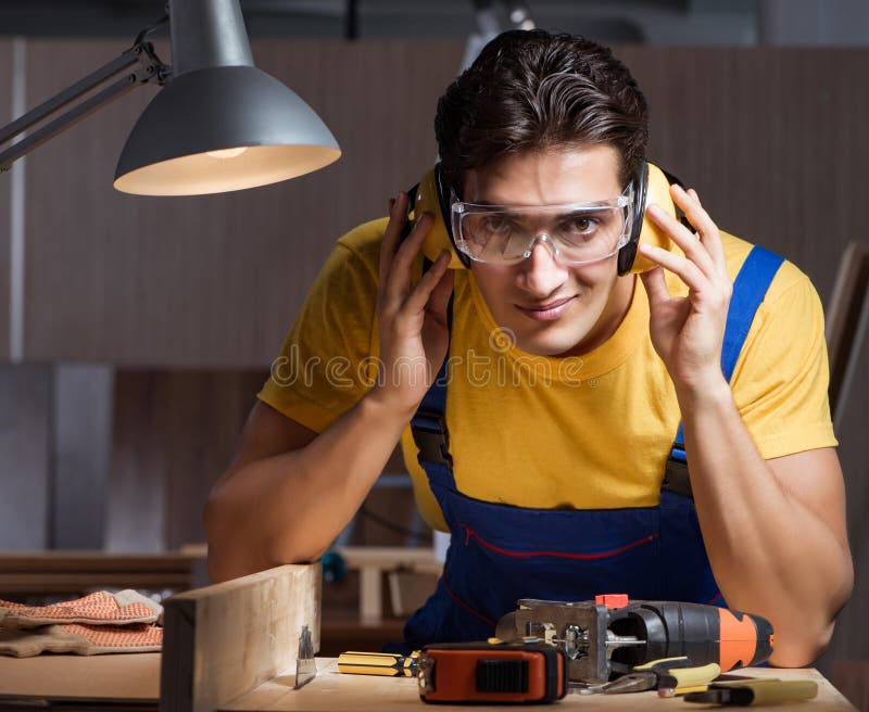 Worker Working in Repair Workshop in Woodworking Concept Stock Photo ...