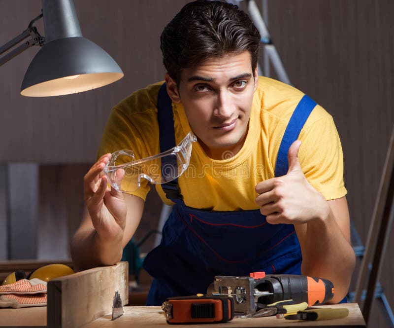 Worker Working in Repair Workshop in Woodworking Concept Stock Photo ...