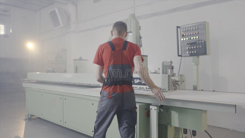 Worker Working at Sawing Machine in Production. Action Editorial Stock ...