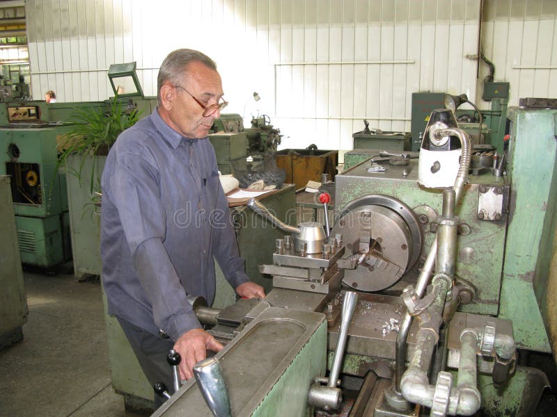 A Worker Works on a Lathe in a Soviet Era Machine Shop Editorial Stock ...