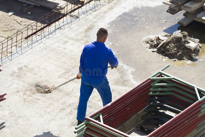 Worker Works with a Shovel, Cleaning Rubble Stock Image - Image of ...
