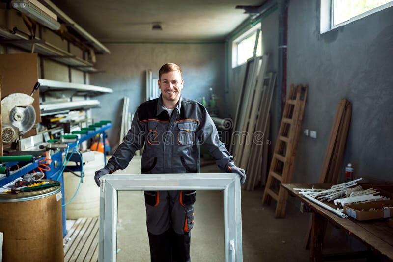 Worker in Workshop for Manufacture of Windows and Doors Stock Photo ...