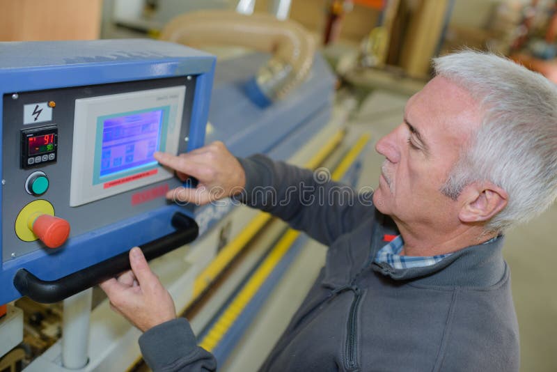 Worker at Workshop Operating Punch Press Machine Tool by Computer Stock ...