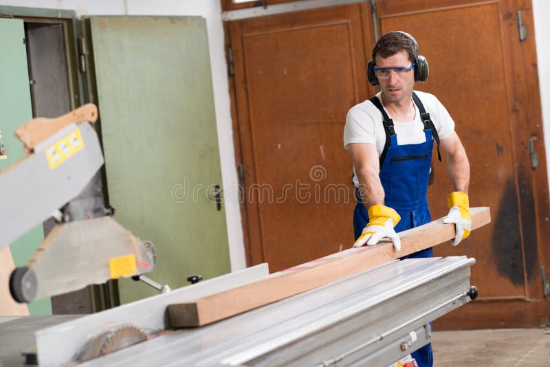 Worker in Workshop Using Saw Machine Stock Photo - Image of furniture ...