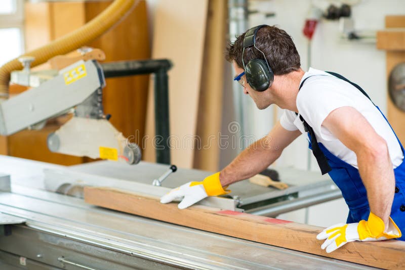 Man, Worker Using a Sliding Compound Mitre Saw Stock Image - Image of ...