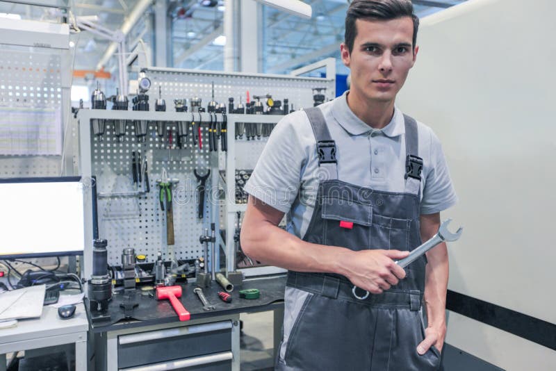 Worker with Wrench at Workplace Stock Photo - Image of industry ...