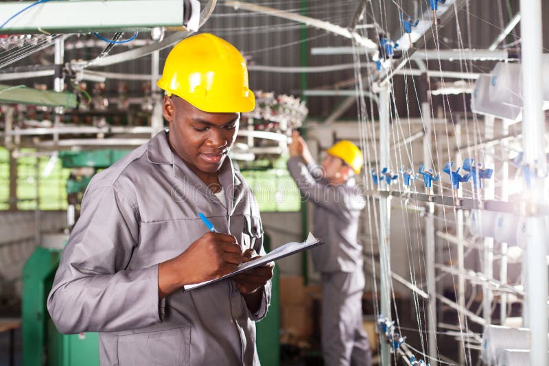 Worker writing report stock photo. Image of helmet, african - 27311044