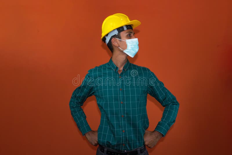 Worker with Yellow Helmet and Pandemic Mask Stock Photo - Image of ...