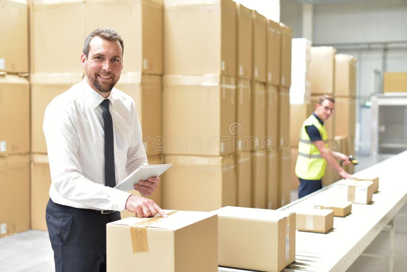 Workerand Manager in a Warehouse in the Logistics Sector - Transport ...
