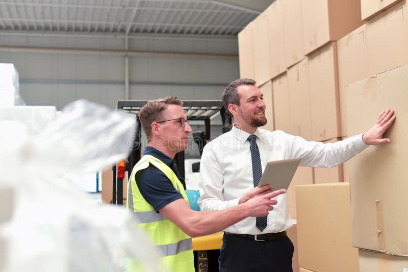 Workerand Manager in a Warehouse in the Logistics Sector - Transport ...
