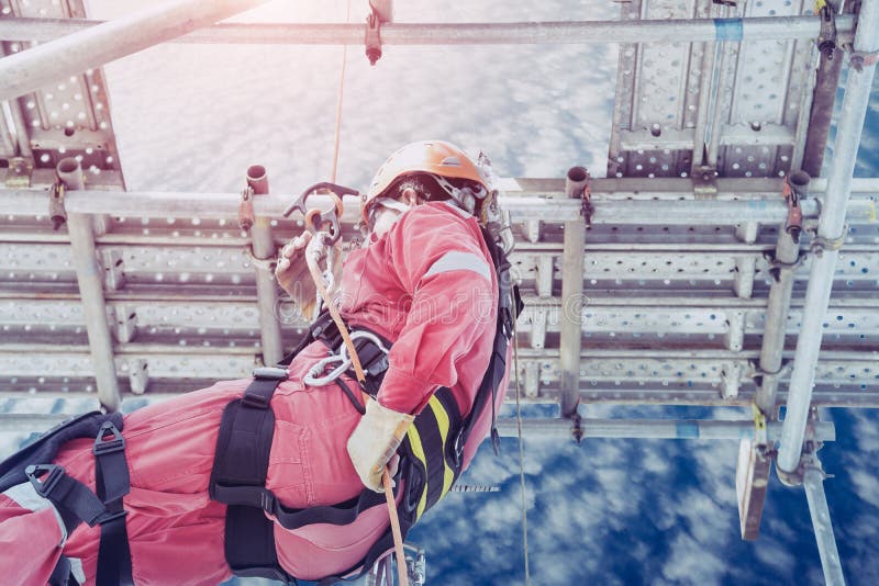 Workers Abseiling and Rope Access in Industrial in Construction Site ...