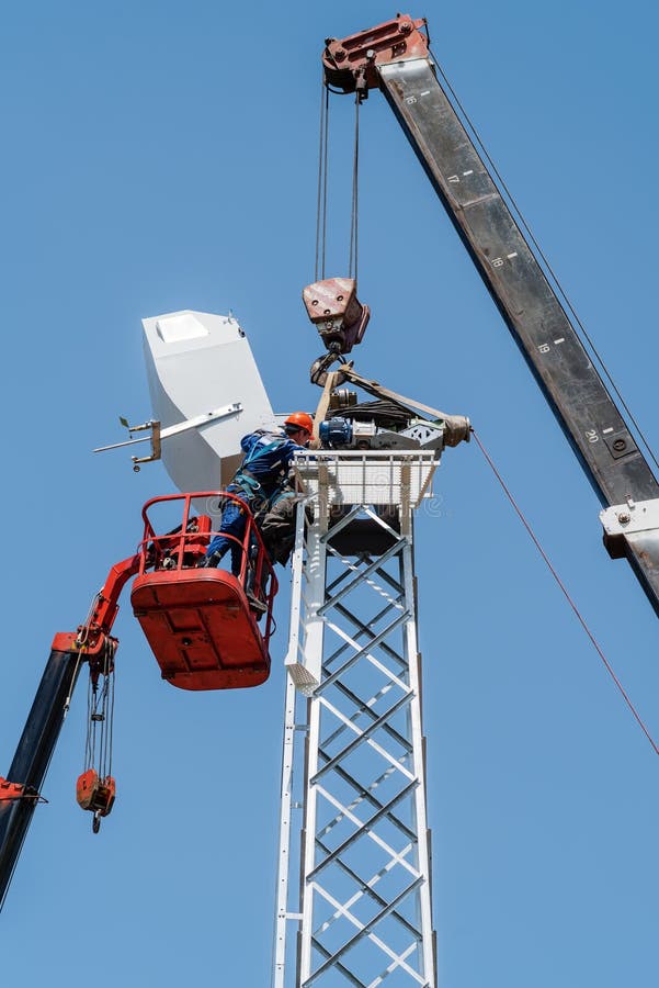 Installation of a Wind Turbine, High Crane Lifting the Nacelle Onto the ...