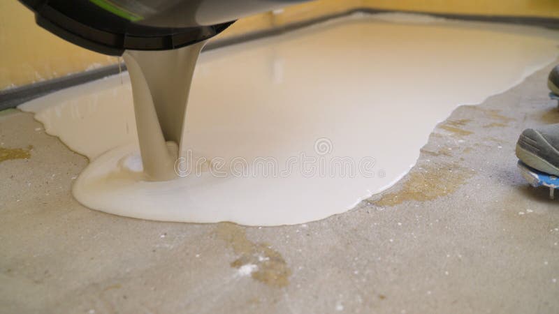 Workers Flood the Floor. Industrial Worker at a Cement Waterproofing ...