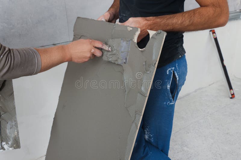 Workers Applying Cement on Tile Indoors, Closeup Stock Image - Image of ...