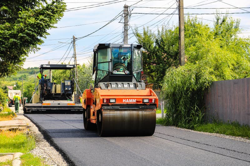 Workers and Asphalting Machines. Construction, Asphalting of New Road ...