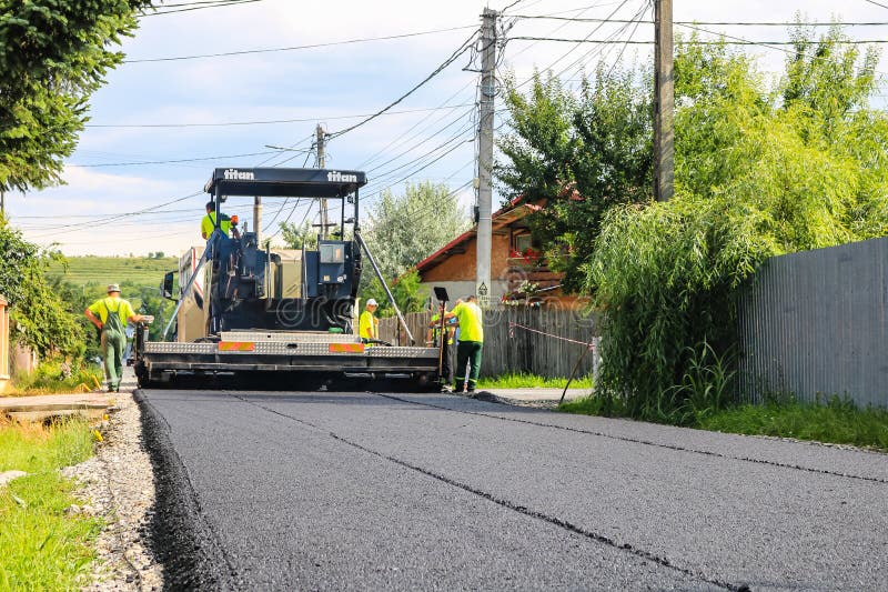 Workers and Asphalting Machines. Construction, Asphalting of New Road ...