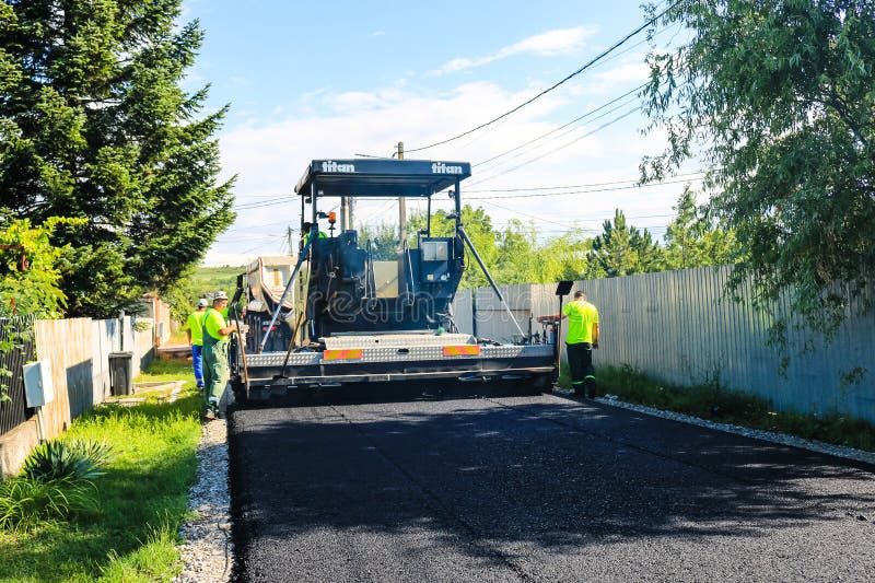 Workers and Asphalting Machines. Construction, Asphalting of New Road ...