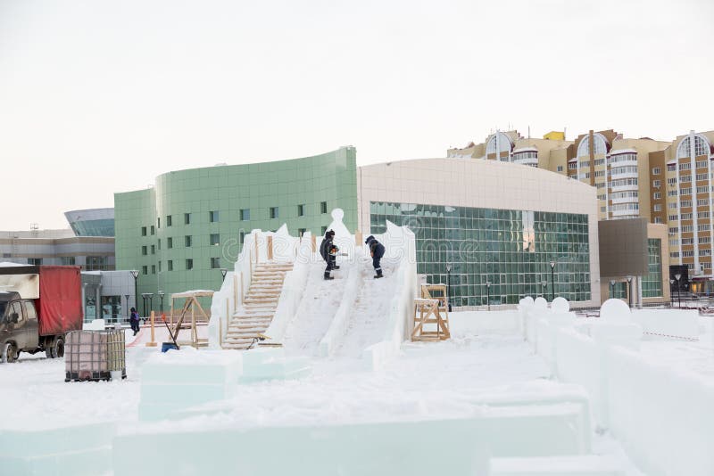 Workers Assemble Ice Blocks on the Frame of a Wooden Slide Stock Photo ...