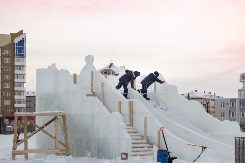 Workers Assemble Ice Blocks on the Frame of a Wooden Slide Stock Photo ...