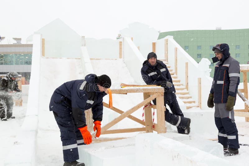 Workers are Assembling Ice Blocks on the Frame of a Wooden Slide Stock ...