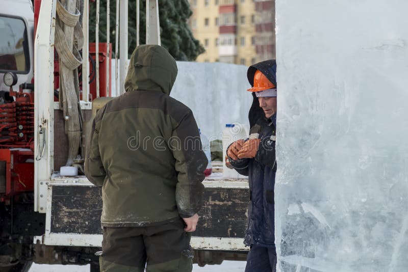 Workers on an Assembly Site at the Truck Crane Stock Photo - Image of ...