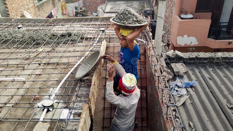 12-01-24 Workers Attach Steel Rods To Make RCC Columns As Per Site ...