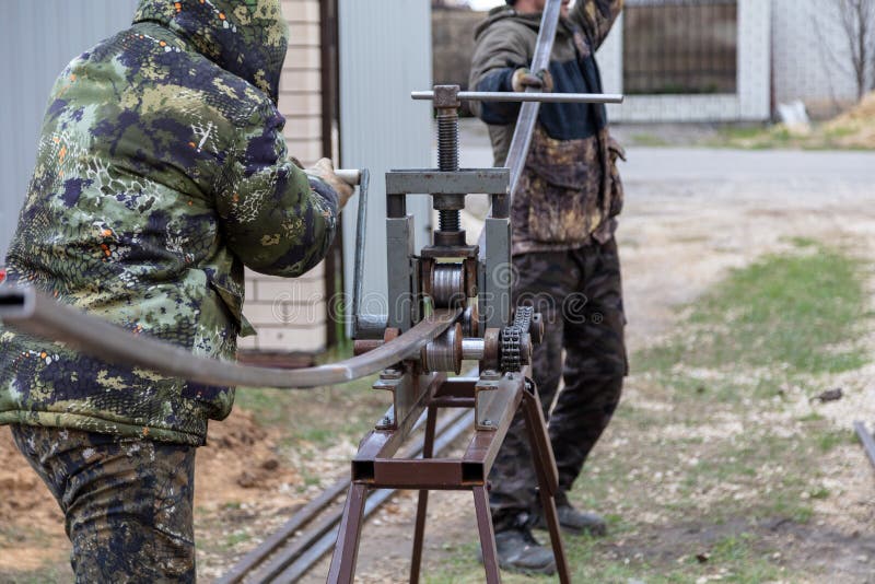 Workers Bend Metal in a Pipe Bender. Stock Image - Image of machine ...