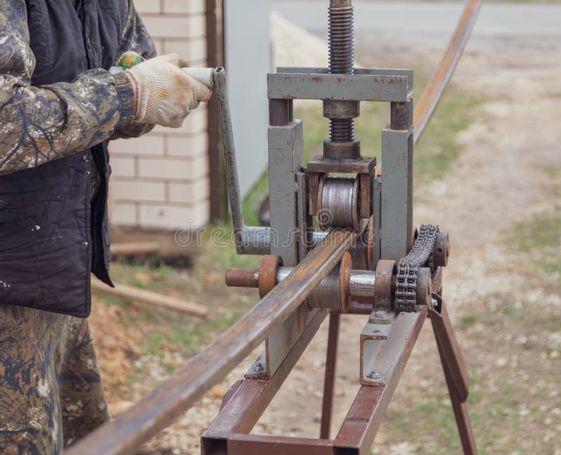Workers Bend Metal in a Pipe Bender. Stock Image - Image of steel ...