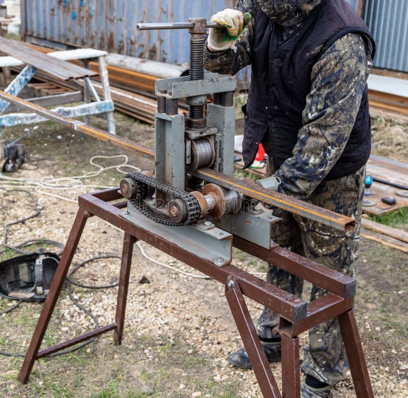 Workers Bend Metal in a Pipe Bender. Stock Image - Image of occupation ...