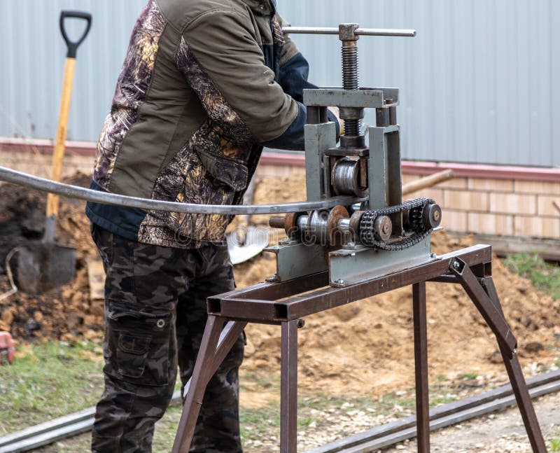 Workers Bend Metal in a Pipe Bender. Stock Image - Image of work, metal ...