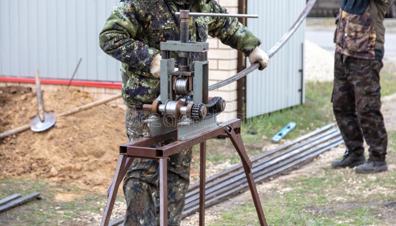 Workers Bend Metal in a Pipe Bender. Stock Image - Image of equipment ...
