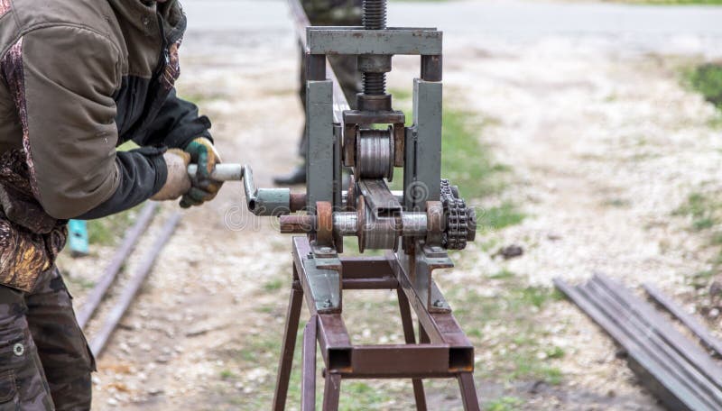 Workers Bend Metal in a Pipe Bender. Stock Image - Image of work ...