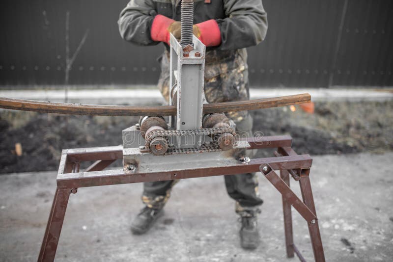 Workers Bending Metal at a Construction Site. Technology Stock Photo ...
