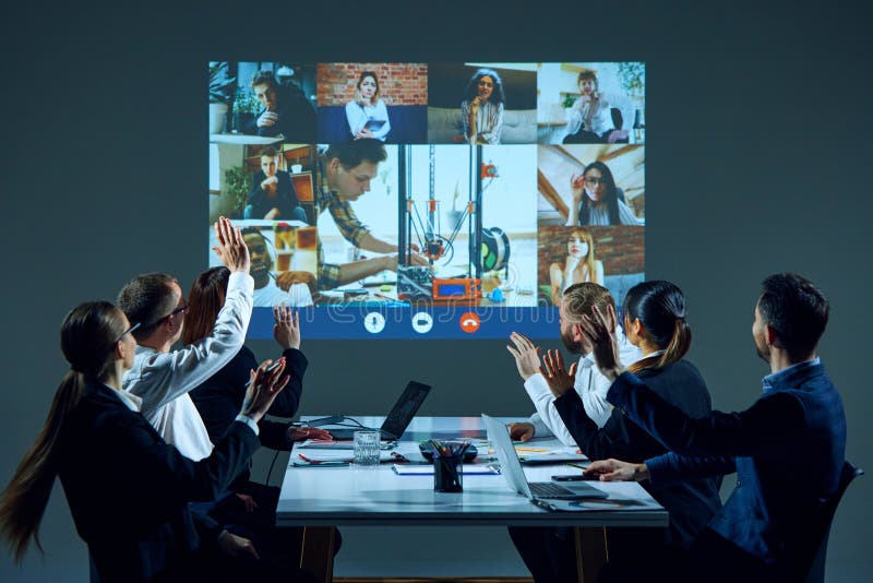 Workers in Boardroom Use Video Conferencing Technology To Connect with ...