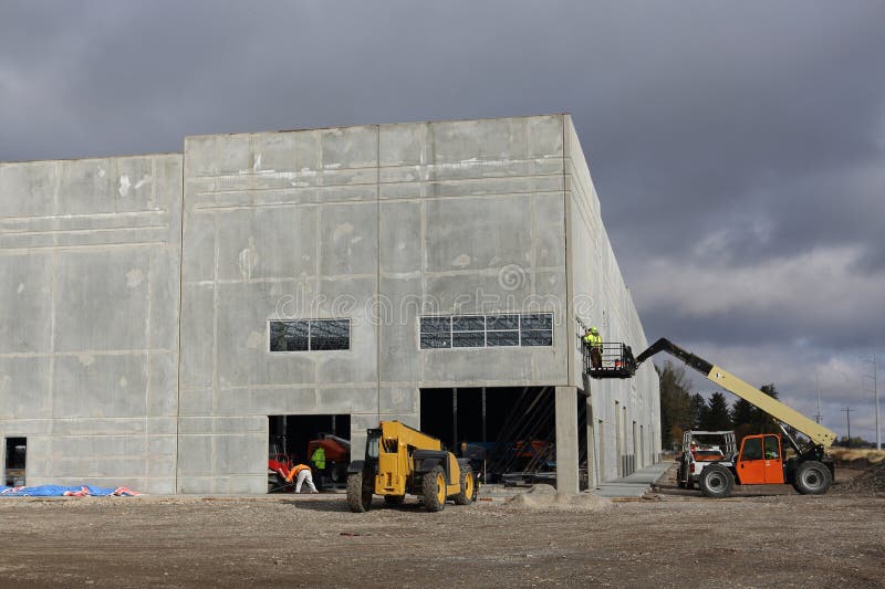 Workers Installing Windows in a Warehouse. Editorial Photography ...