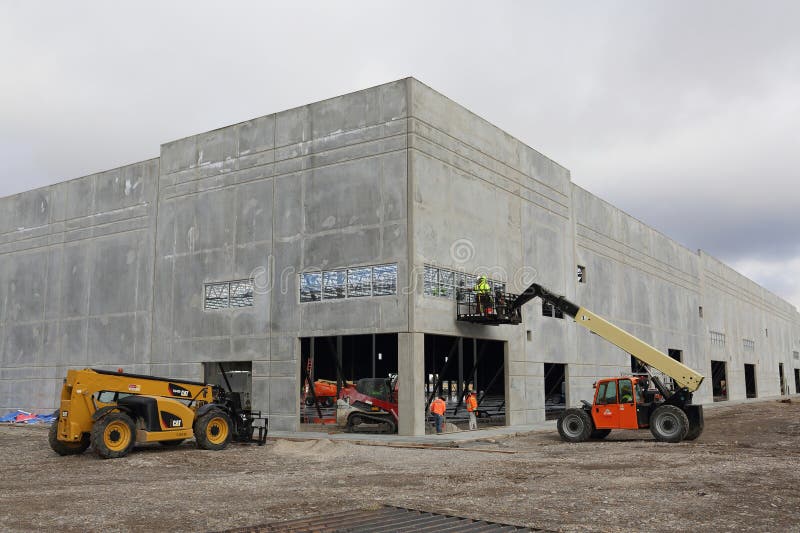 Workers Installing Windows in a Warehouse. Editorial Stock Photo ...
