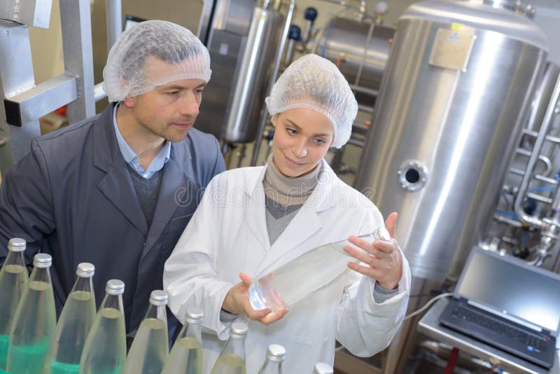 Workers with Bottled Water in Factory Stock Image - Image of filling ...