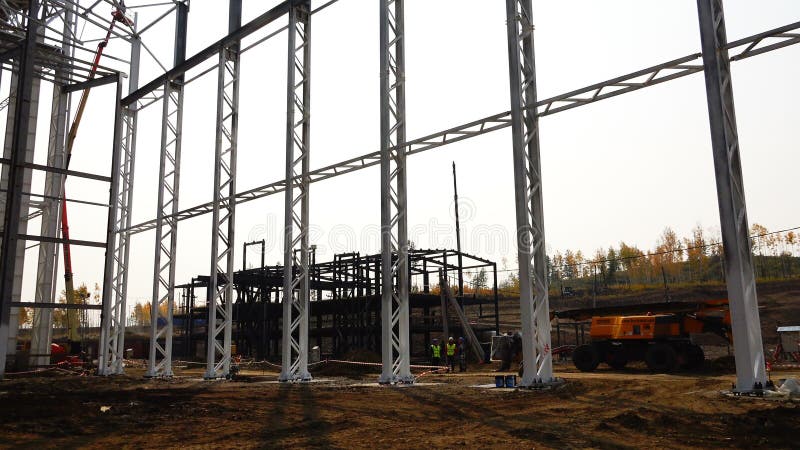 Workers` Brigade at the Construction Site Stands Under the Metal ...