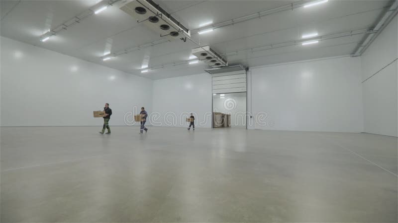 Workers Bring Boxes into the Warehouse. Warehouse Workers. Warehouse ...