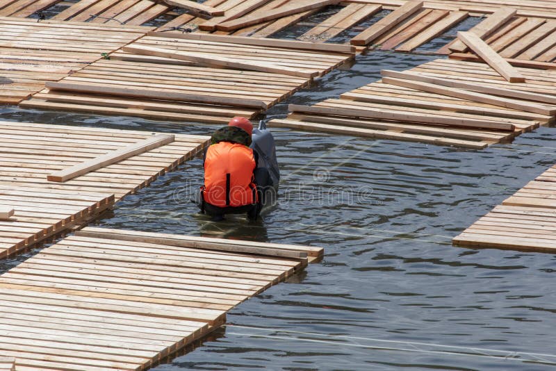 Workers Build a Dam of Wood on the River Stock Photo - Image of floats ...