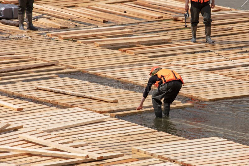 Workers Build a Dam of Wood on the River Stock Image - Image of ...