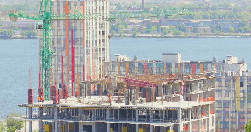 Workers Build House. Construction of a Multi-storey Building. Work at ...