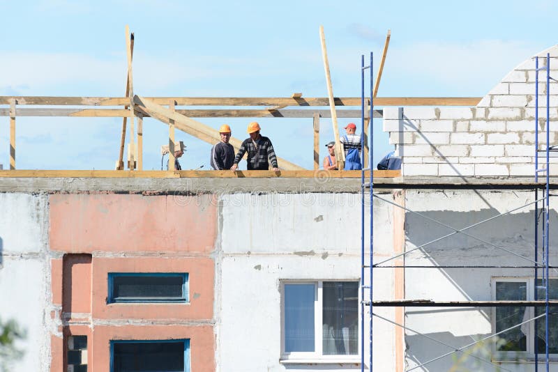 Workers Builders Make Installation of Scaffolding. Editorial Stock ...