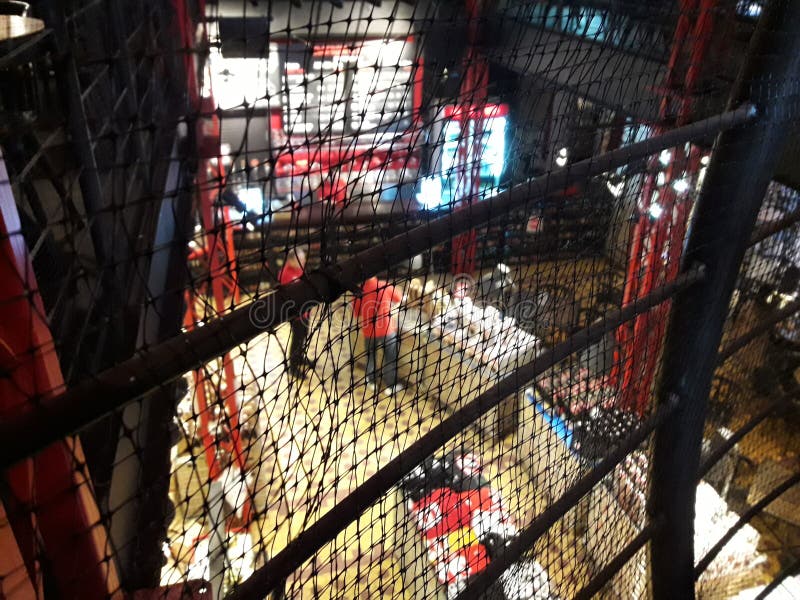 Workers at a Cafe As Seen through a Guard Rail with Netting Stock Image ...