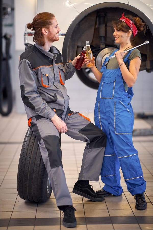 Workers in Car Garage Having a Break Stock Photo - Image of keeping ...